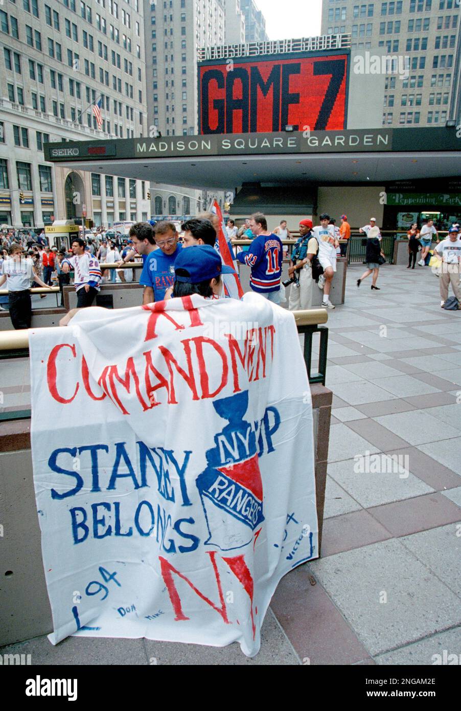 New York Rangers fan Michael Ten wears a banner prior to Game seven of ...