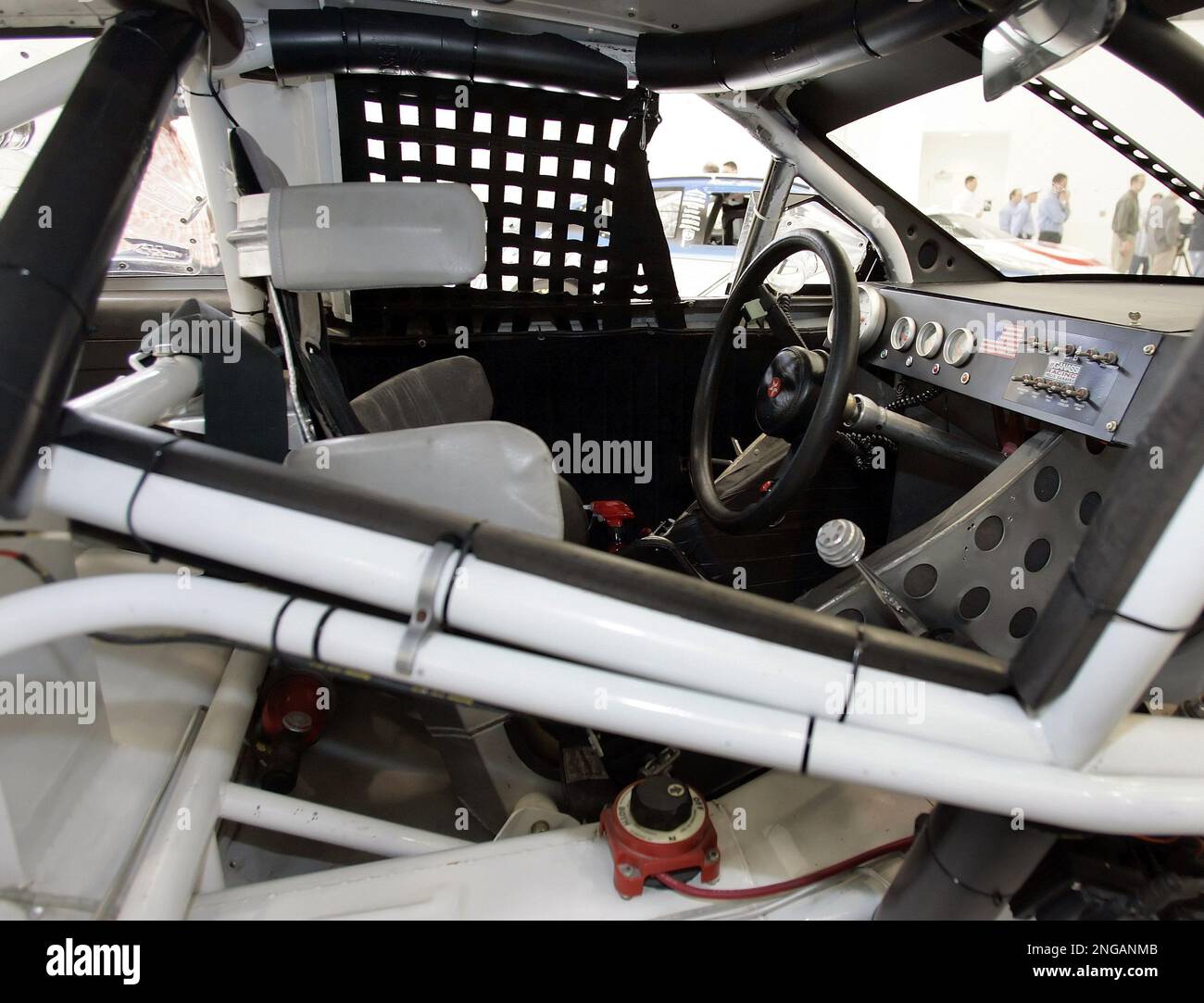 The driver's cockpit of a NASCAR race car is shown during a stop in the ...