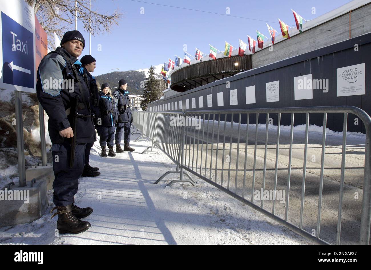 Police officers patrol in front of the Congress Center in Davos ...
