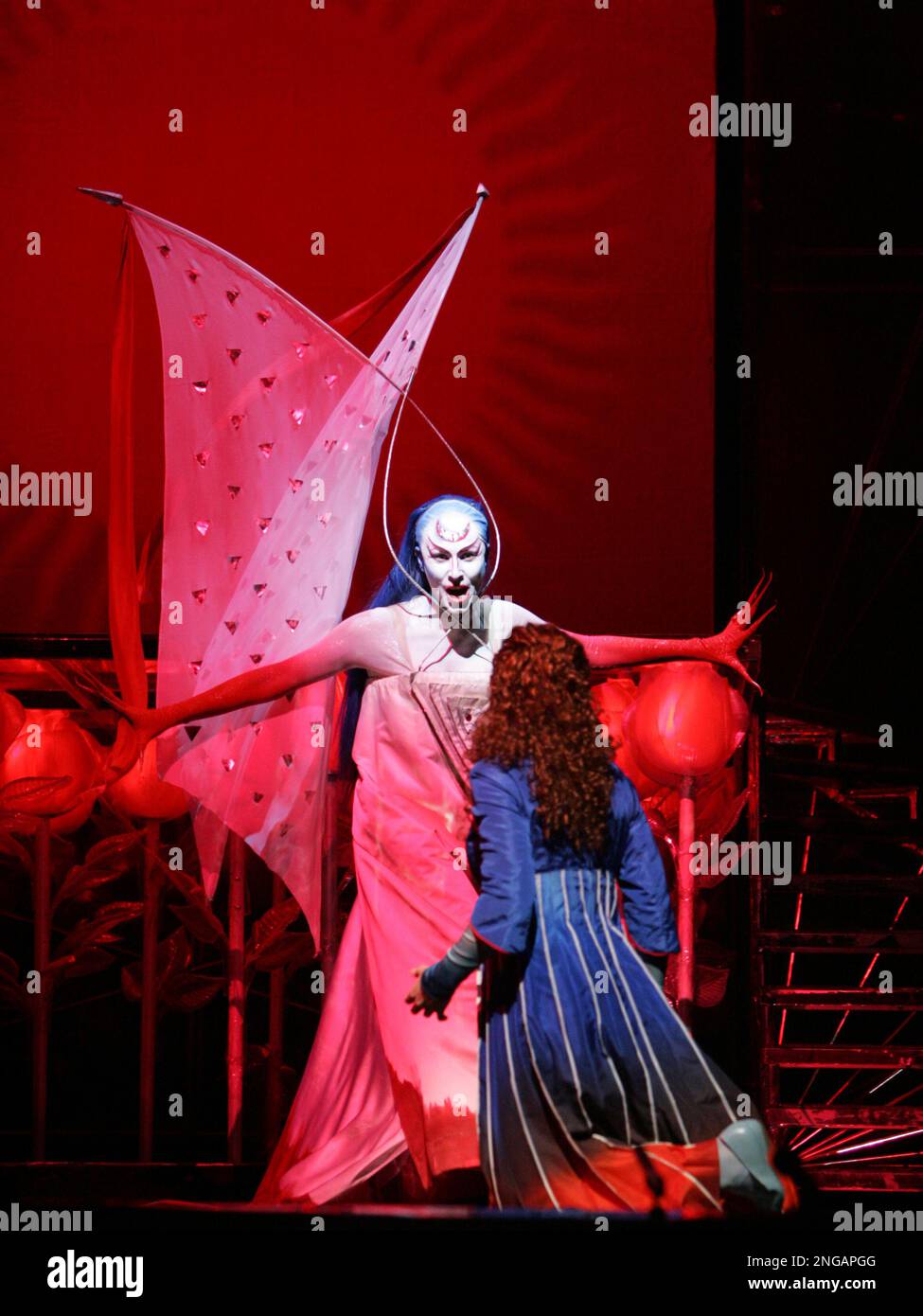 Erika Miklosa, facing camera, performs as Queen of the Night alongside ...