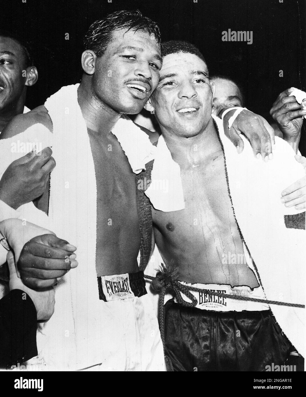 American boxer Sugar Ray Robinson, left, puts a consoling arm around ...