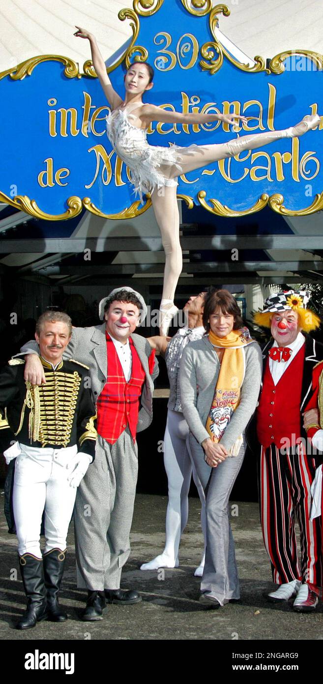 Princess Stephanie of Monaco, center right, poses with clowns and ...