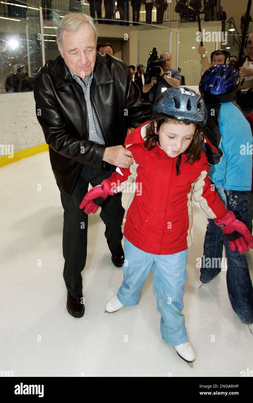 Liberal leader Paul Martin gives Abbie Stairs, 7, a helping hand as she ...