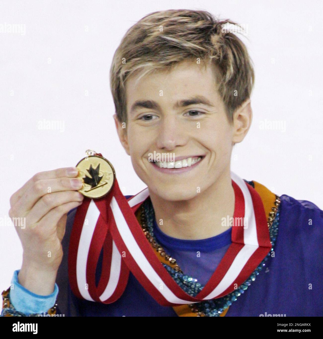 Senior men's gold medalist Jeffrey Buttle of Barrie, Ont. shows off his ...