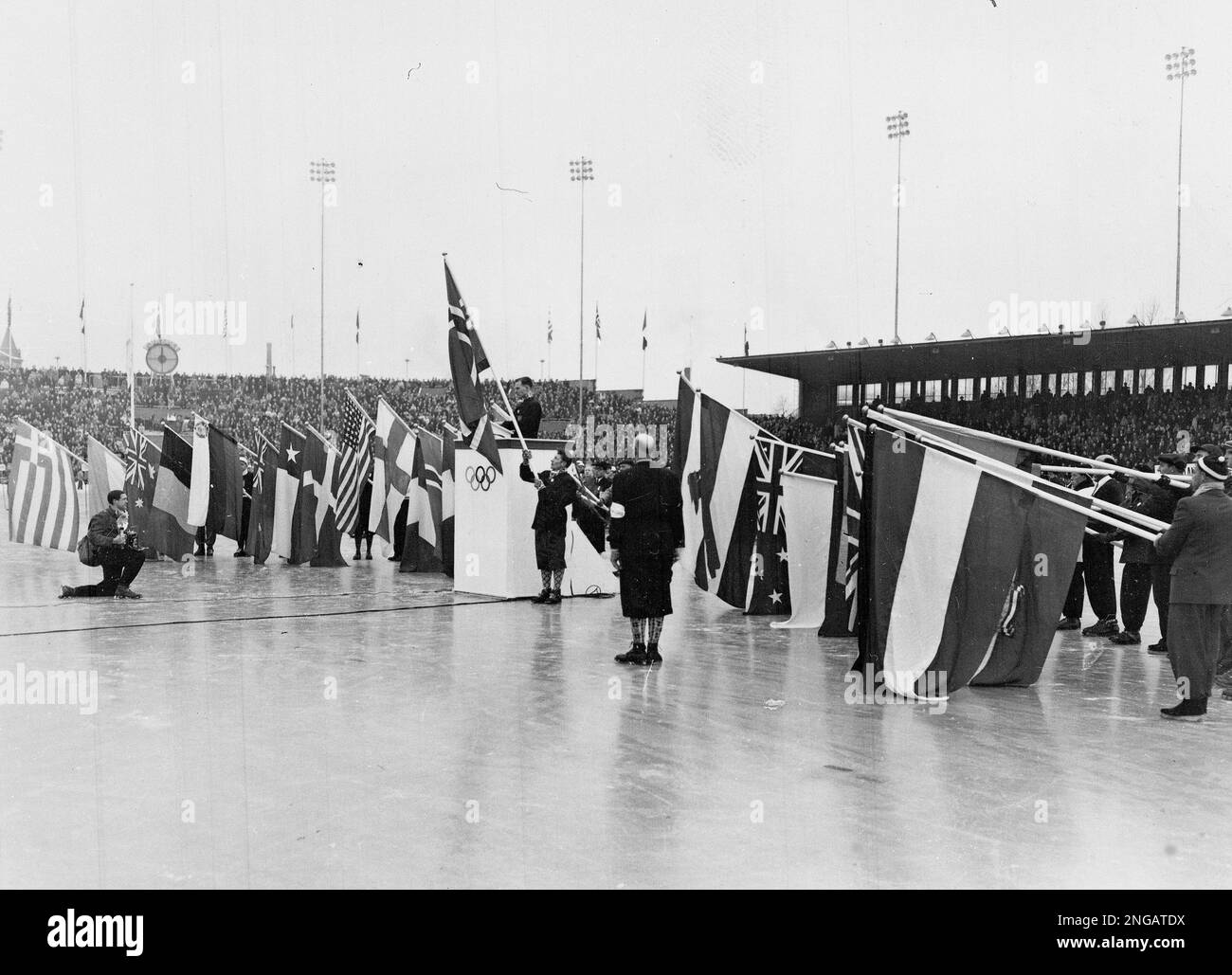 Norwegian Ski-jumper Torbjorn Falkanger,centre on podium, takes the ...