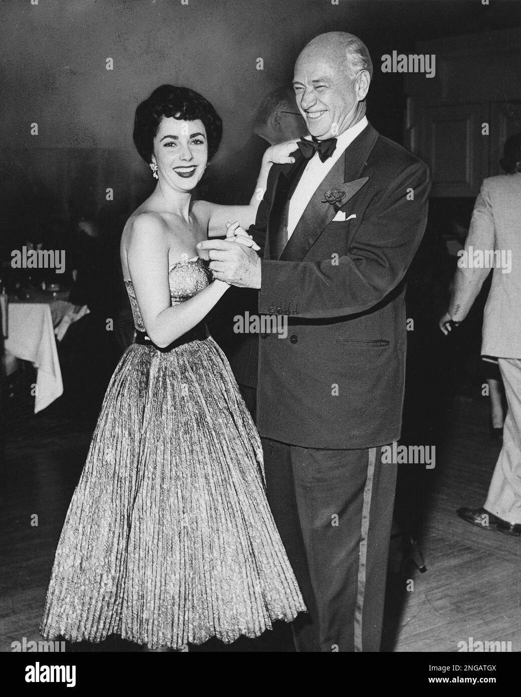 Actress Elizabeth Taylor and hotel magnate Conrad Hilton dance in the ...