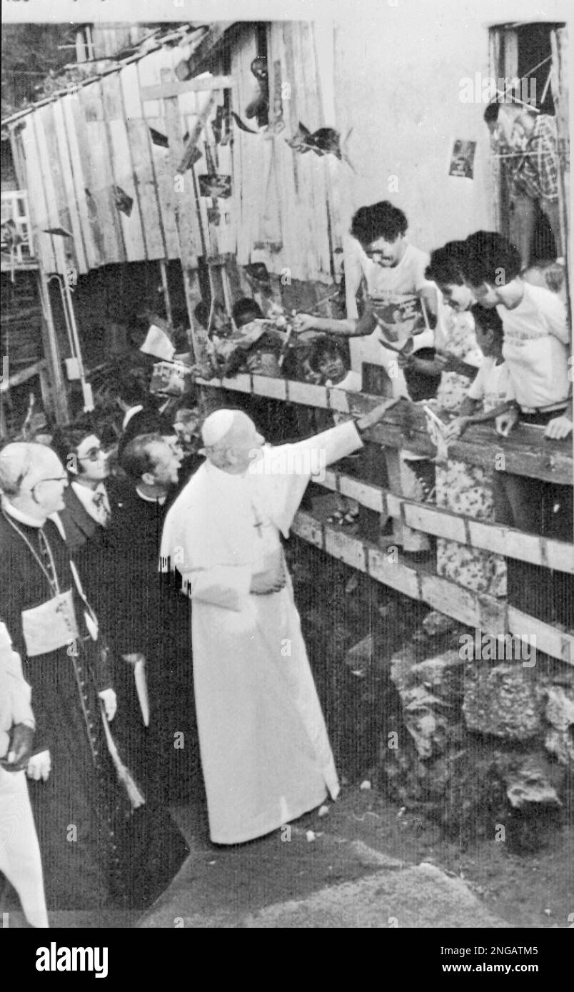 Pope visits Slums - Pope John Paul II. waves at a family living in the ...