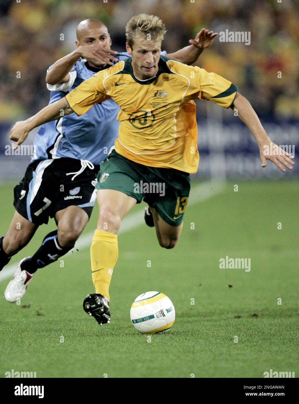 Australian Vincent Grella right, takes the ball from Uruguay's Diego ...