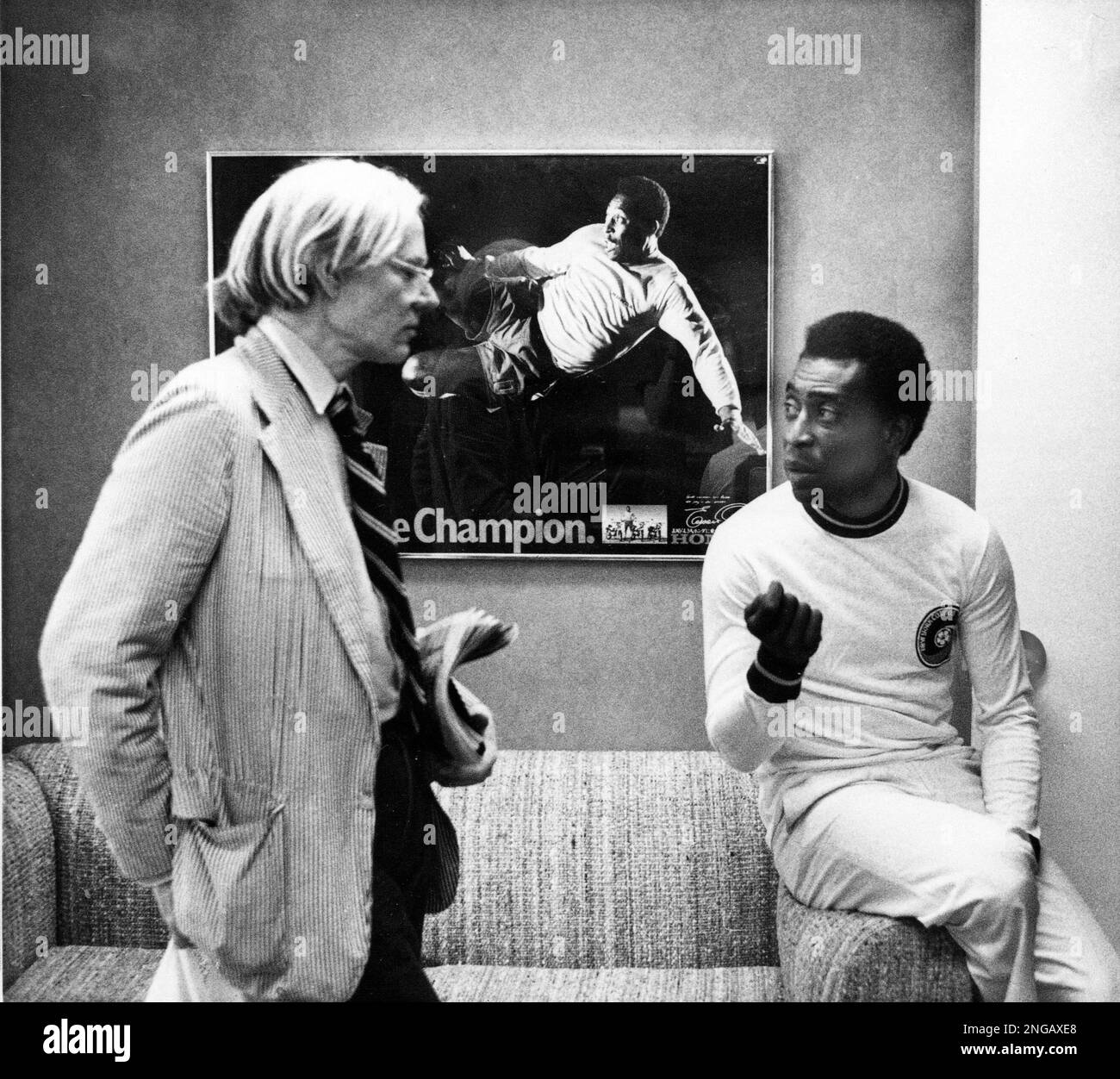 Artist Andy Warhol, left, chats to soccer superstar Pele about a ...