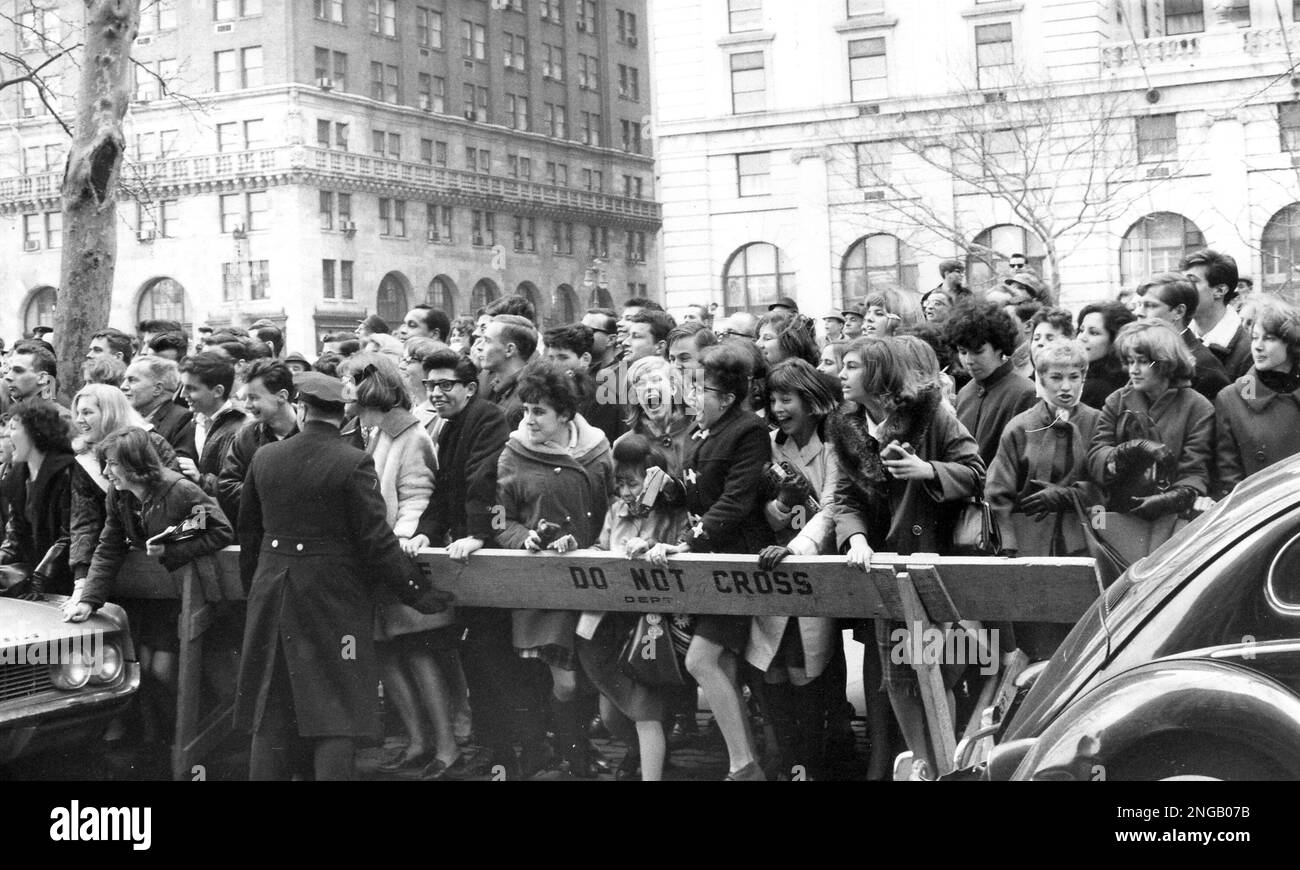 Police enforce the barricades outside New York's Plaza Hotel as fans ...
