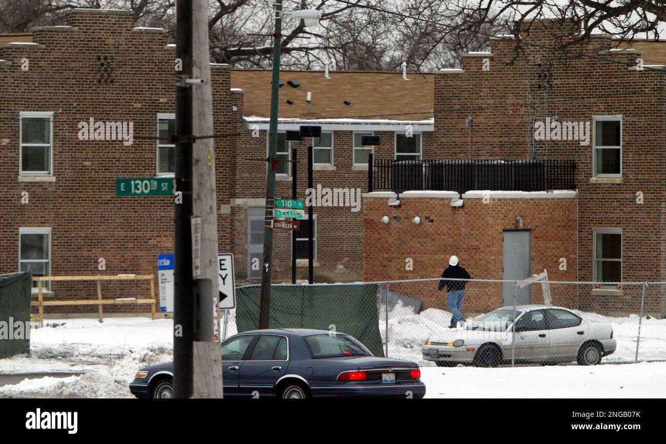 A construction worker enters the Altgeld Gardens housing project on ...