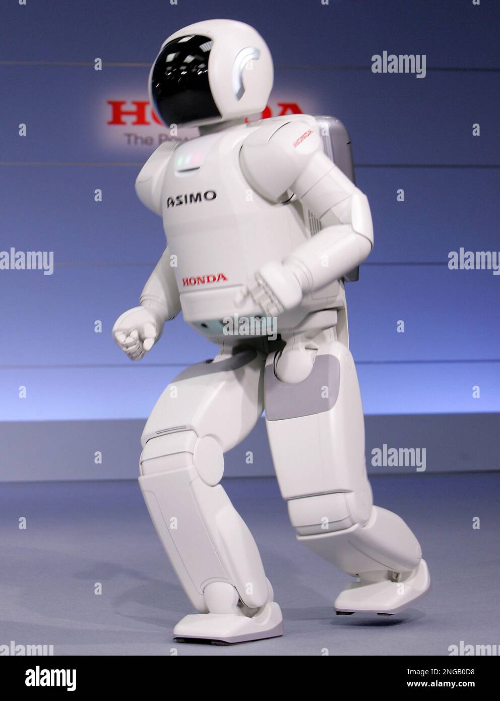 Honda Motor Co.'s new humanoid robot ASIMO jogs during a demonstration ...