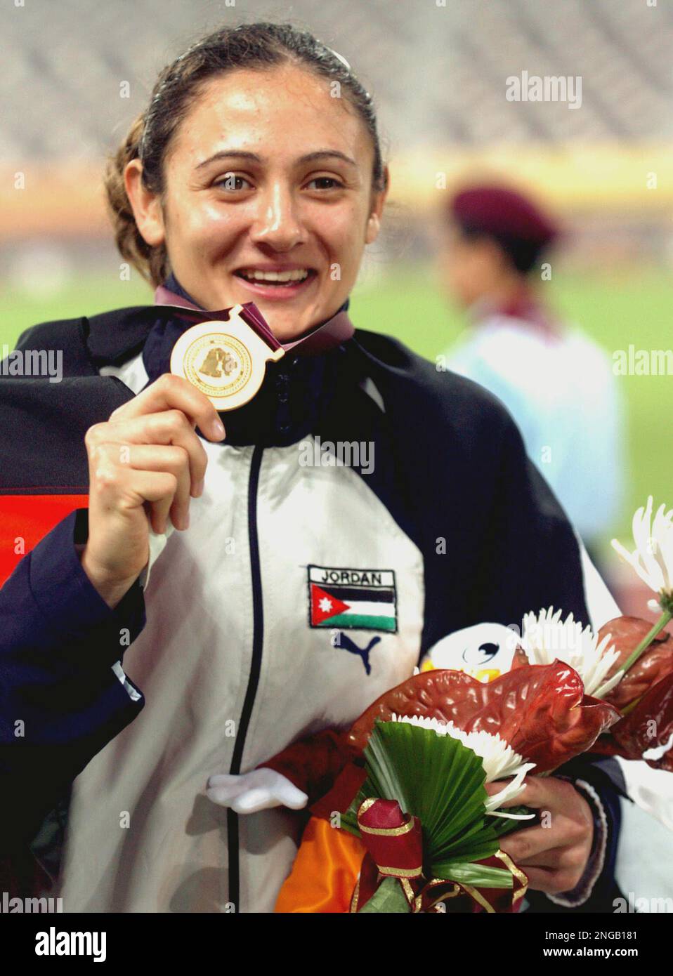 Women's long jump gold medal winner Rima Tahaposes of Jordan, poses ...