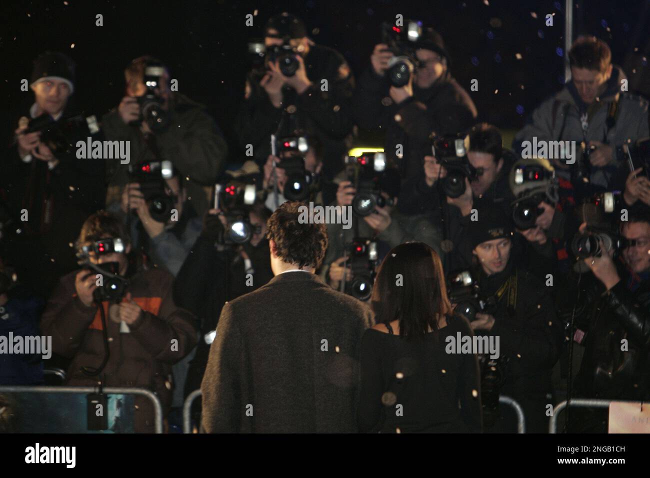 Photographers take pictures of celebrities arriving for the world film ...