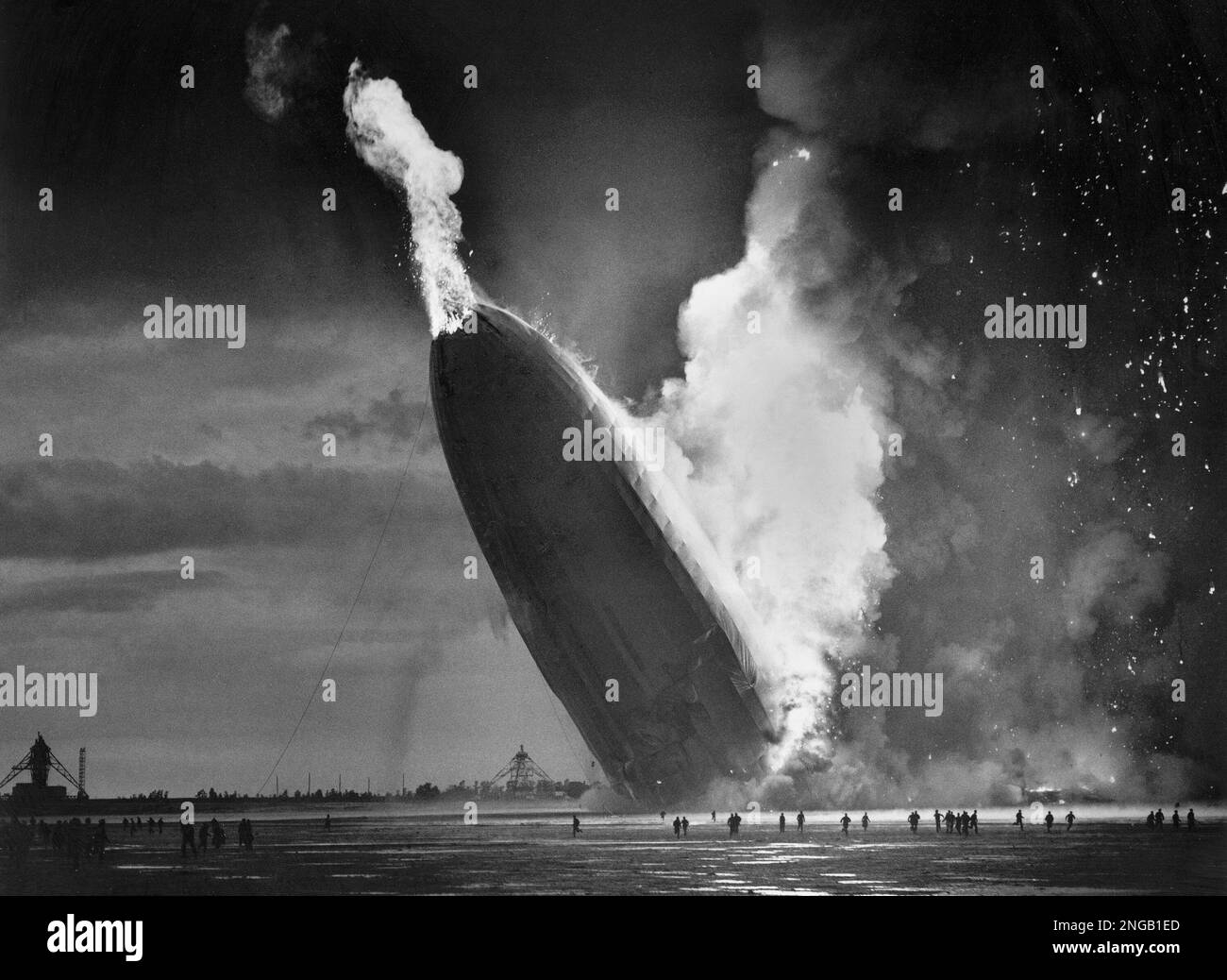The German dirigible Hindenburg crashes to earth, tail first, in ...