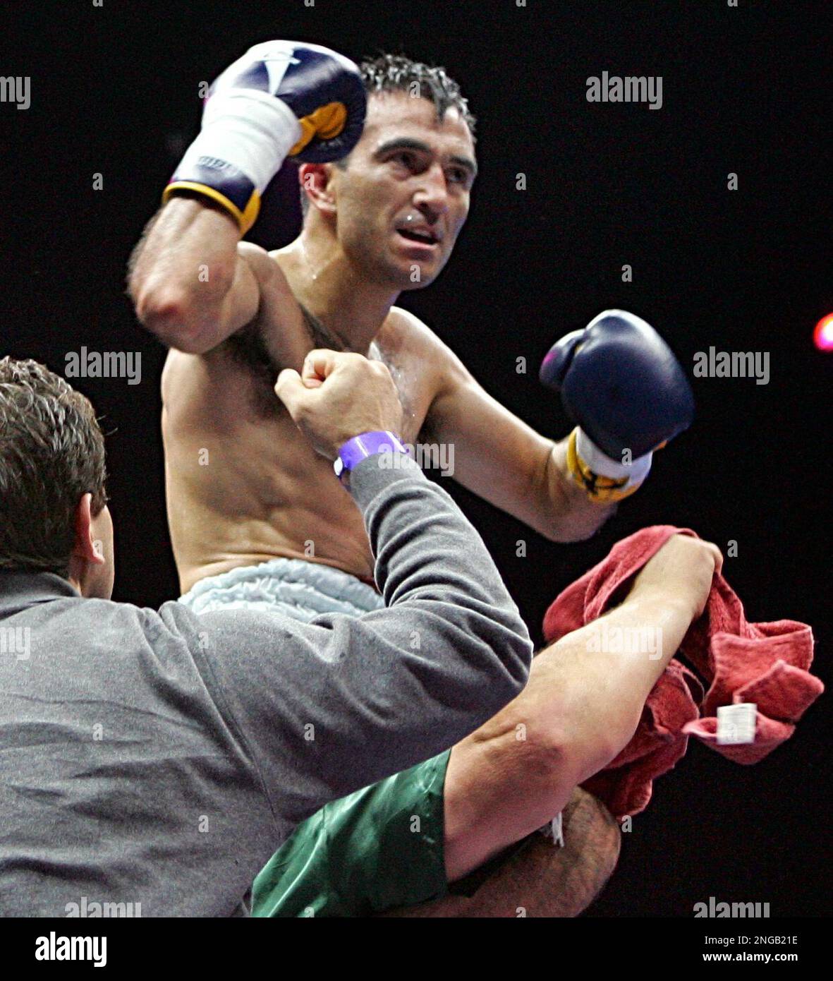 Argentinian boxer Omar Narvaez raises his arms in victory after ...