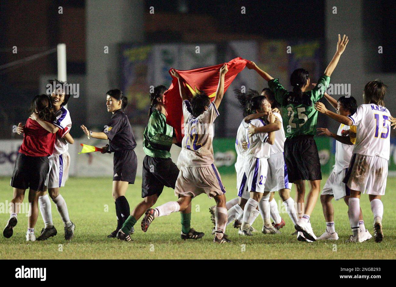 Vietnam team carries the national flag after winning against Myanmar ...