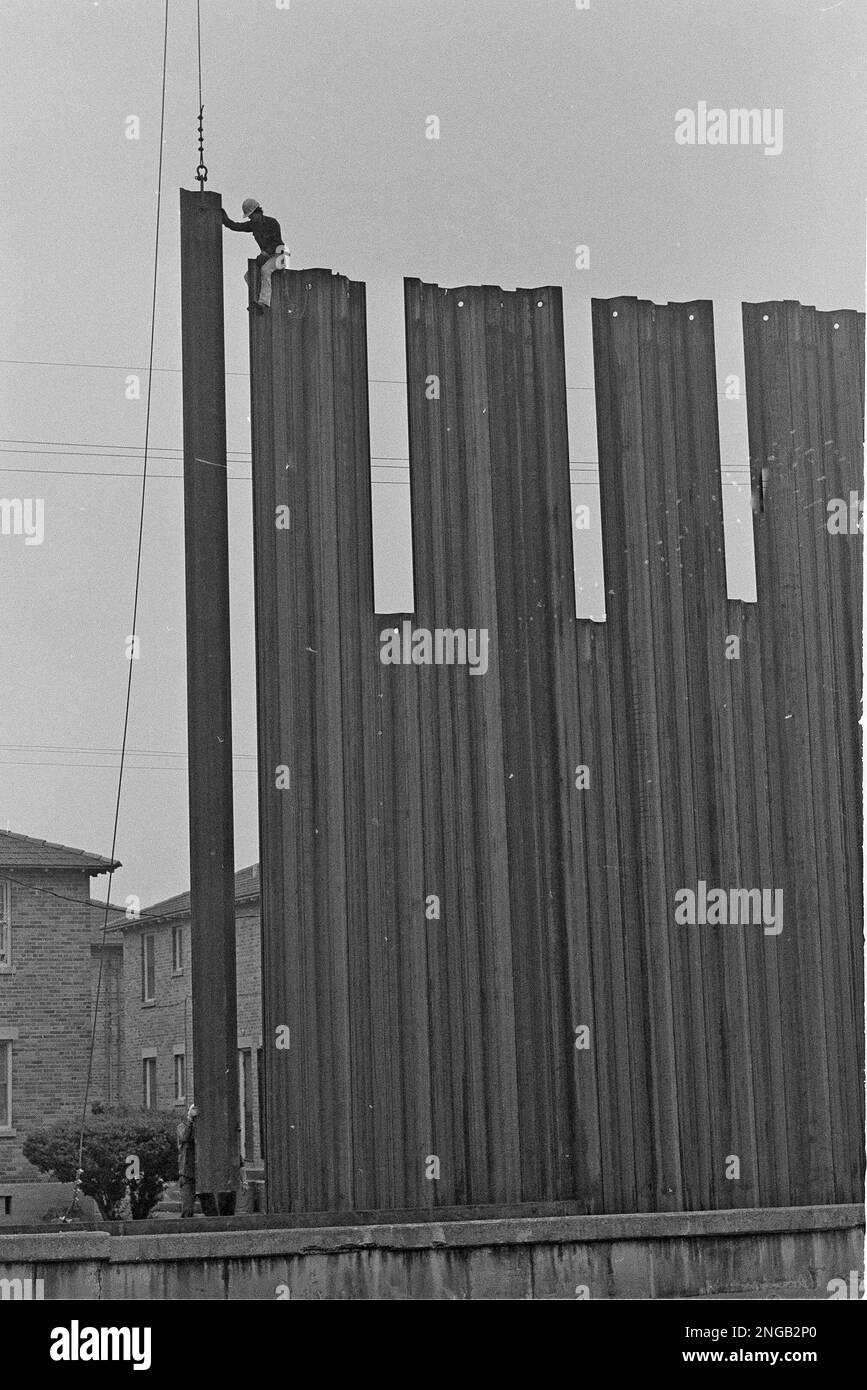 Tim Mooney can find solitude in his work perched high atop sheet piling ...