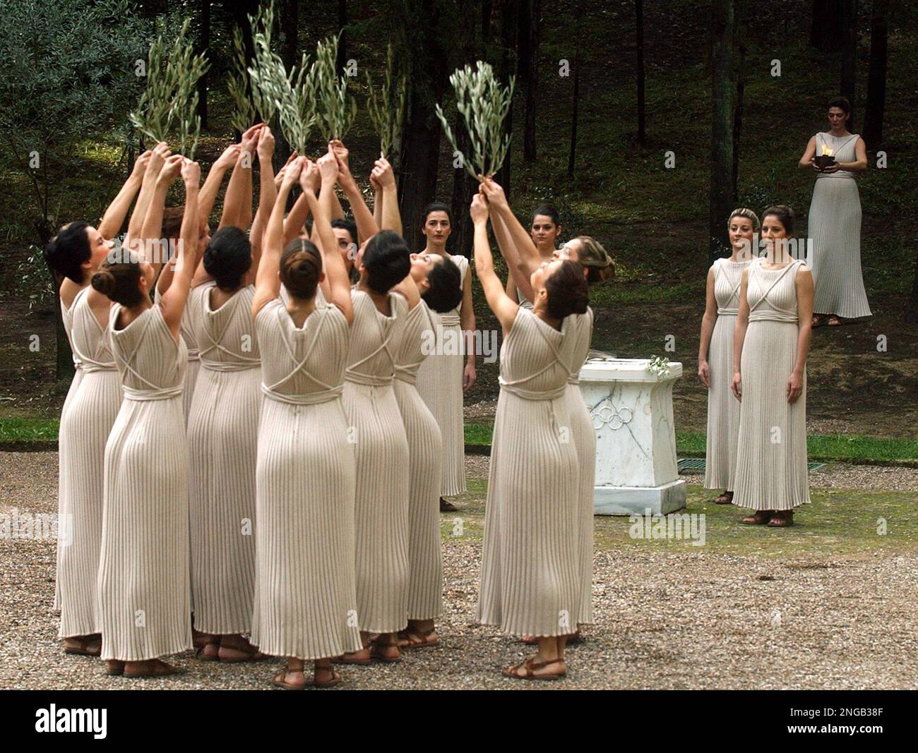 A group of priestesses dances as Theodora Siarkou, who plays the role ...