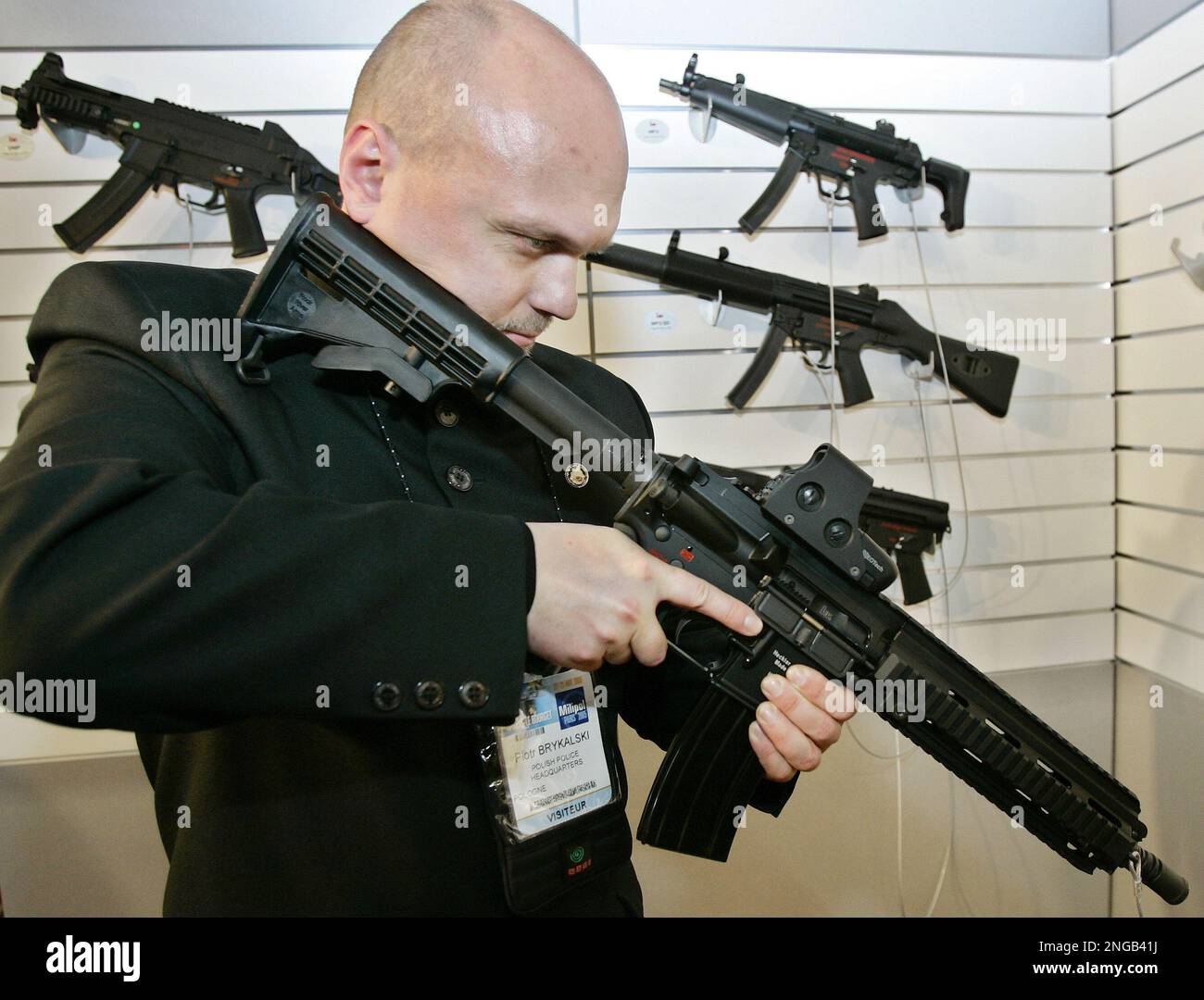 Police officer Piotr Brykalski from Poland looks at the new HK416 ...