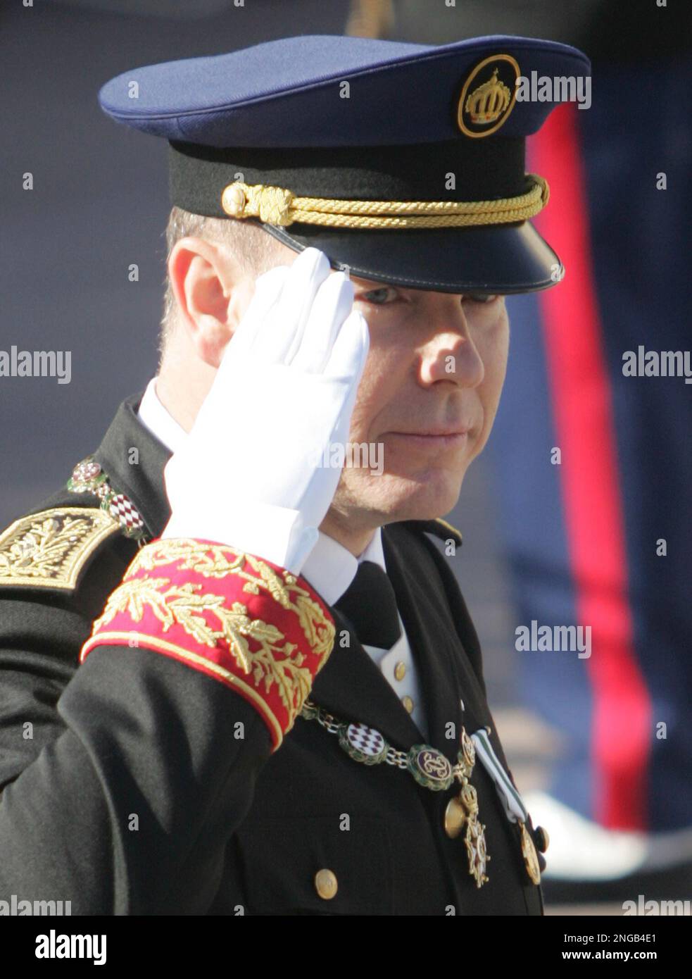 Prince Albert II of Monaco salutes guards outside the Monaco palace ...