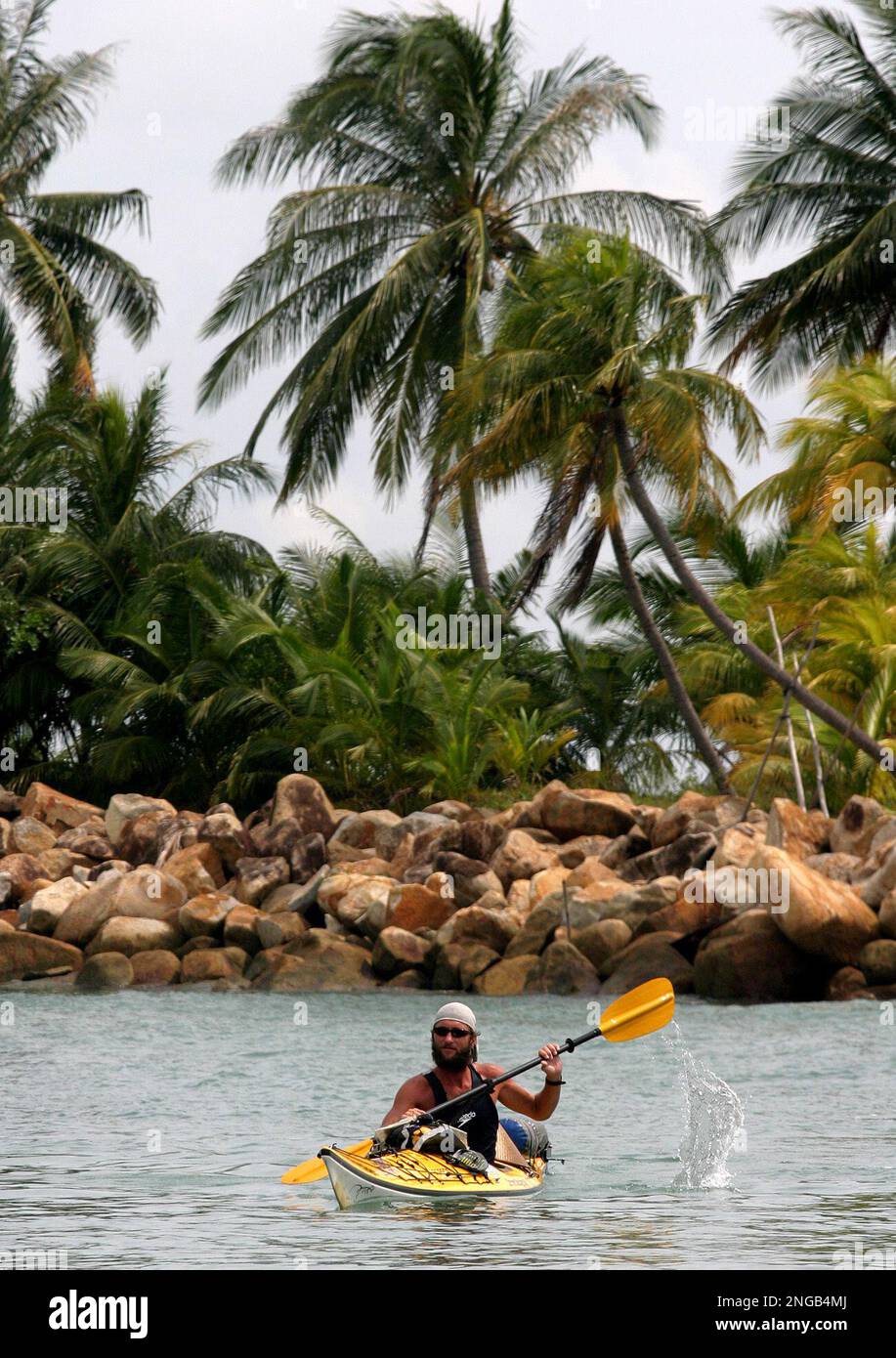 Jason Lewis, 37, is seen paddling towards the Tanjong Beach in this ...
