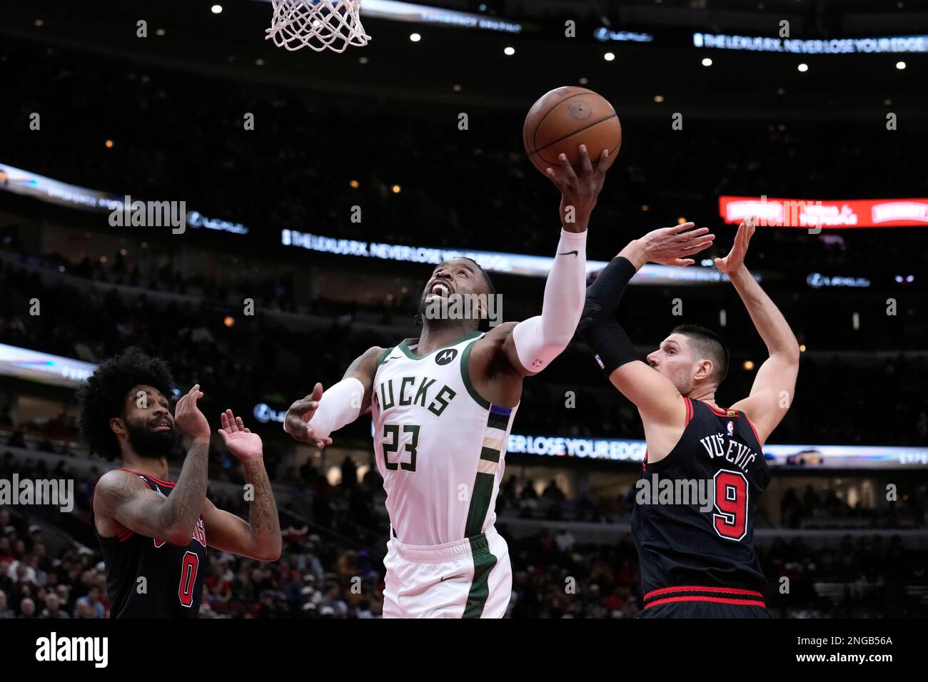 Milwaukee Bucks' Wesley Matthews (23) shoots between Milwaukee Bucks ...