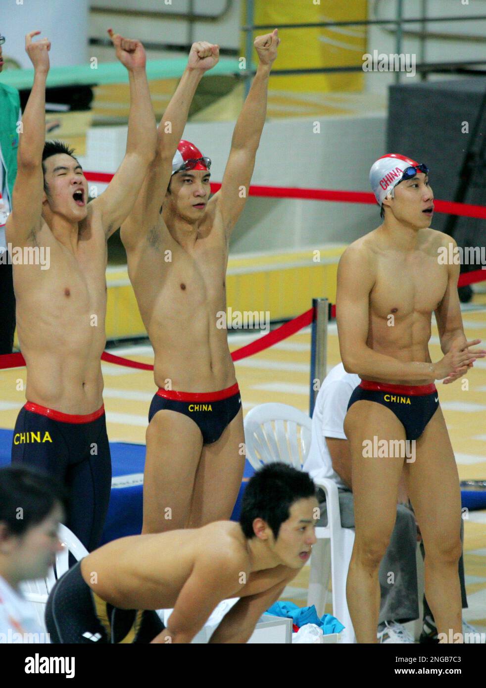 China swimming team from left, Cai Li, Huang Shaohua and Liu Yu celebrate after winning the Men ...