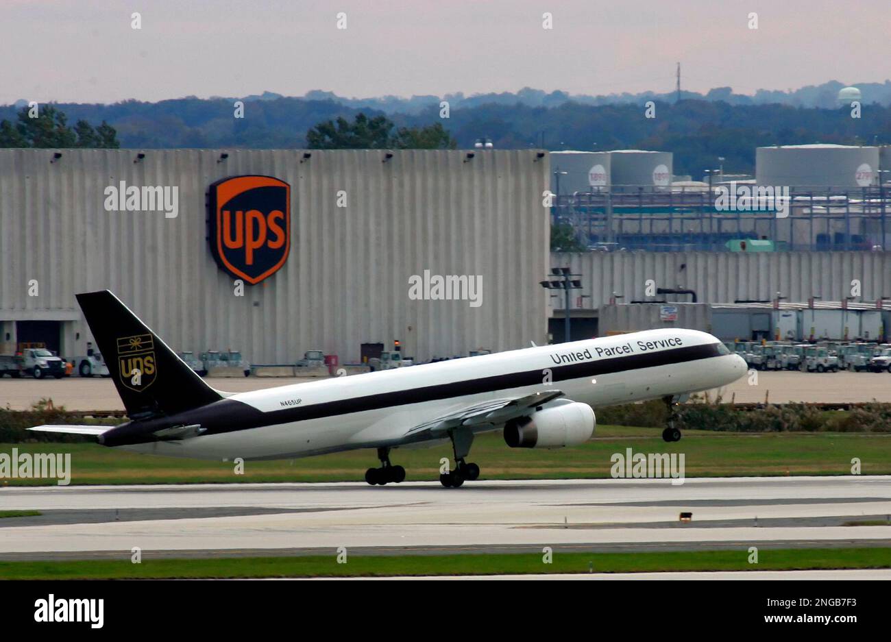Passing its terminal, a UPS plane takes off from Philadelphia ...