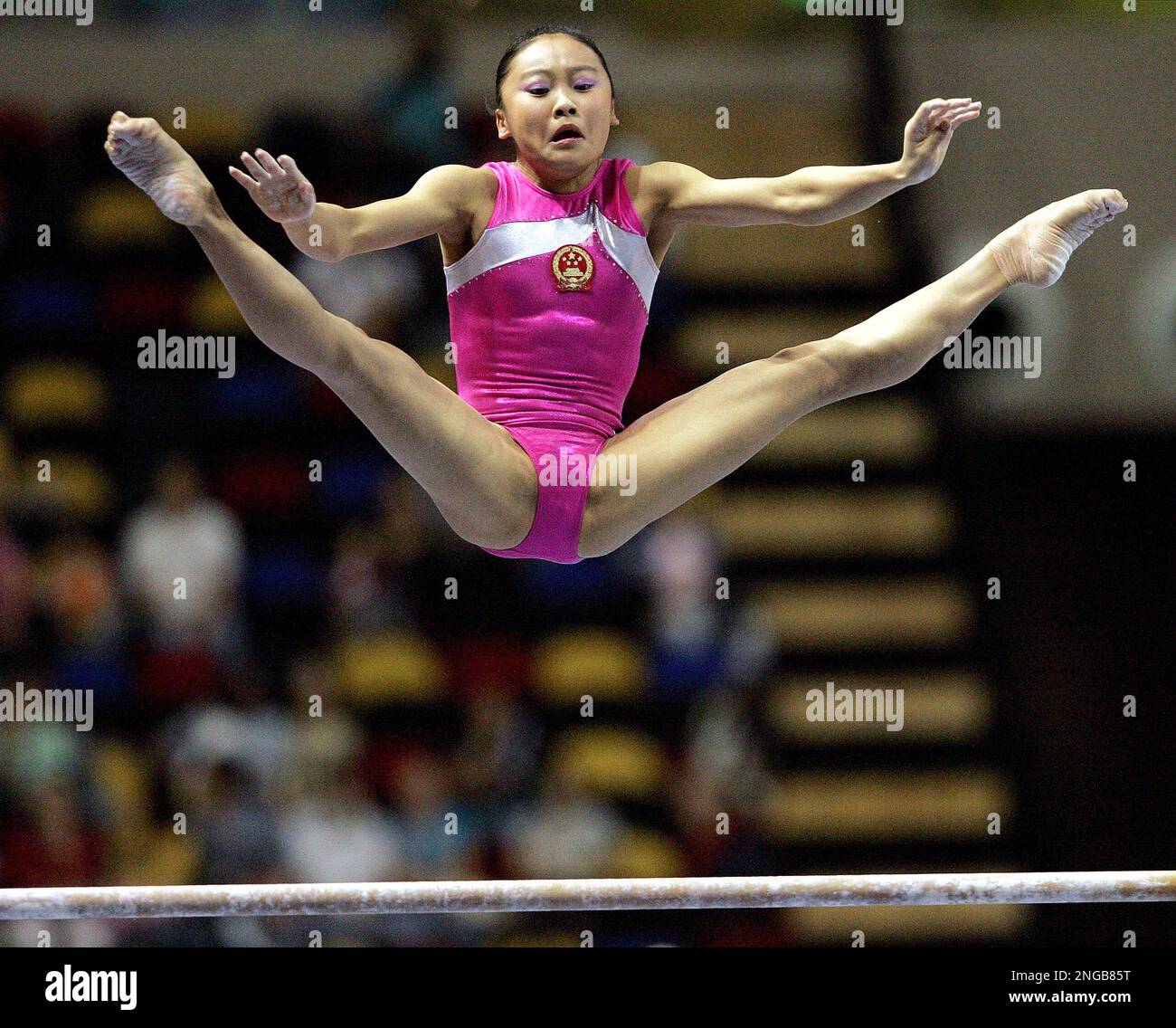 China's Li Ya competes in the women's uneven bars final of the fourth ...