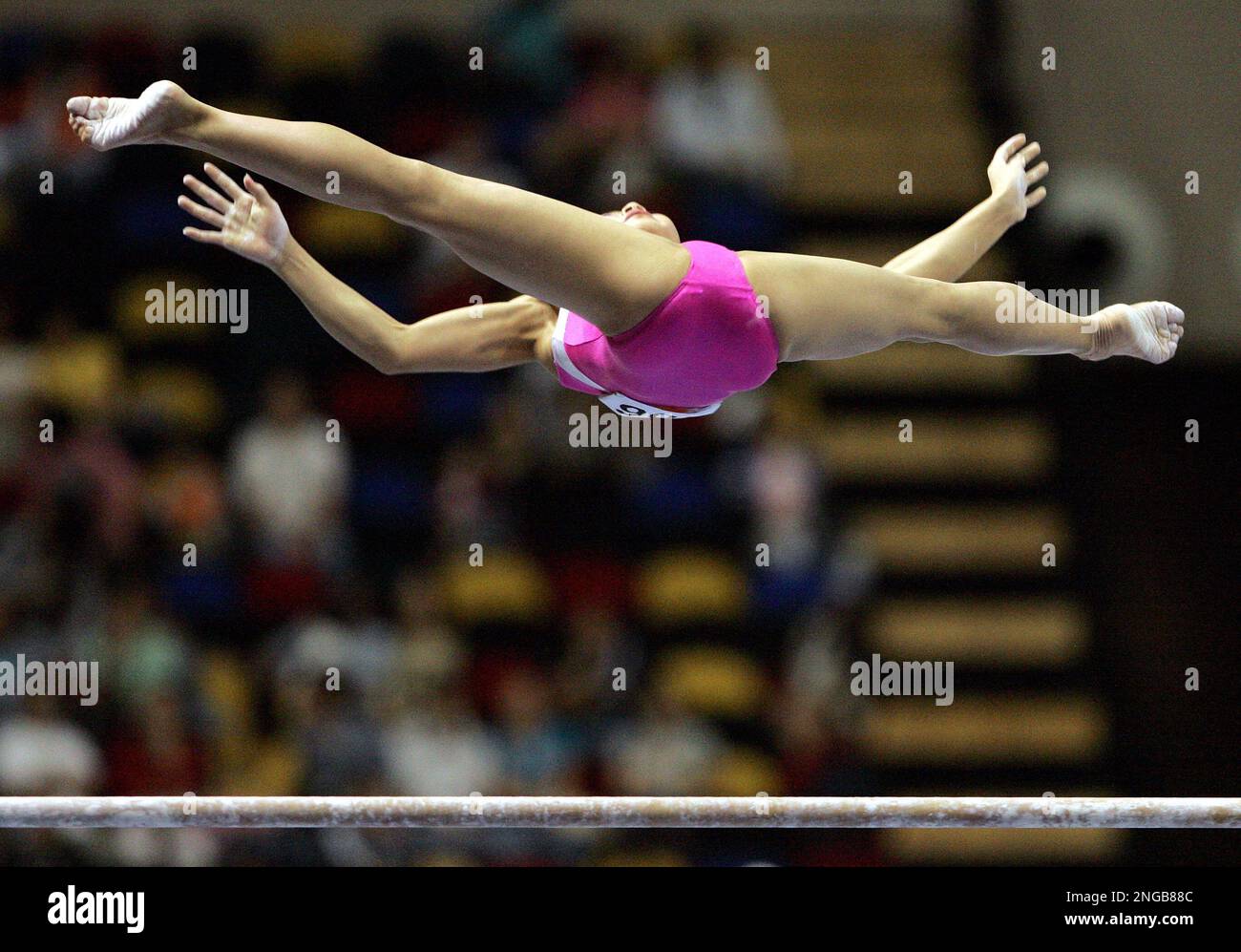 China's Li Ya competes in the women's uneven bars final of the fourth ...