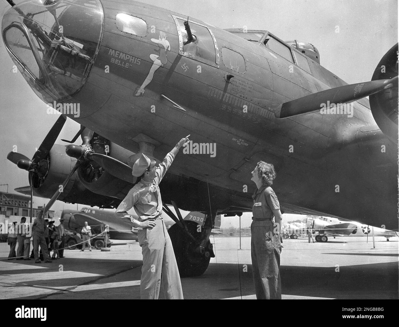 Capt. Vincent B. Evans of Henderson, Tex., left, tells a mechanic ...