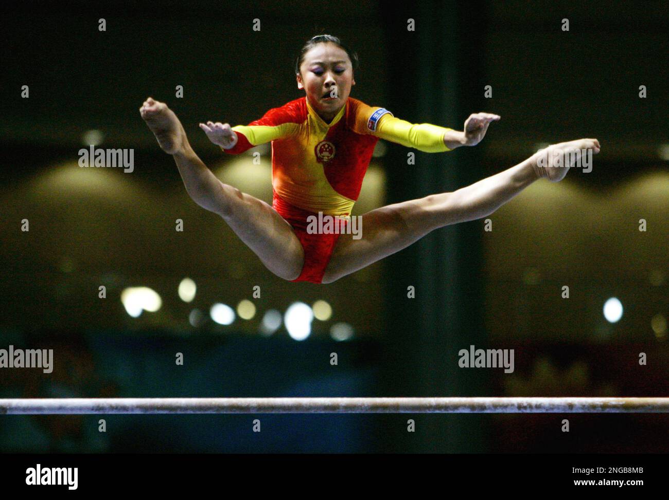 China's gymnastist Li Ya competes at the uneven bars during the Women's ...