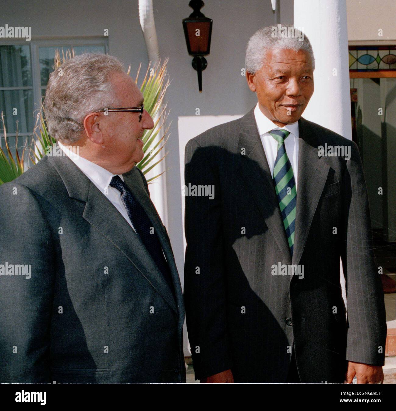 Former U.S. Secretary of State Henry Kissinger, left, and African ...