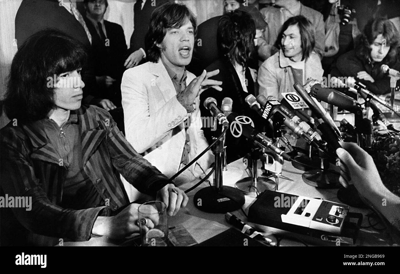 Mick Jagger, second from left, gestures during a news conference, May ...