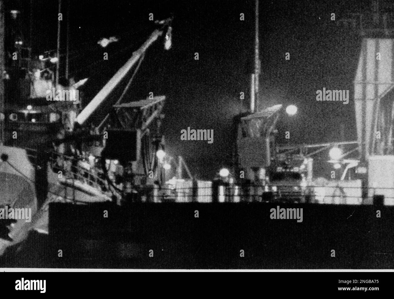 A military ambulance, right of center with lights on, waits for the U.S ...
