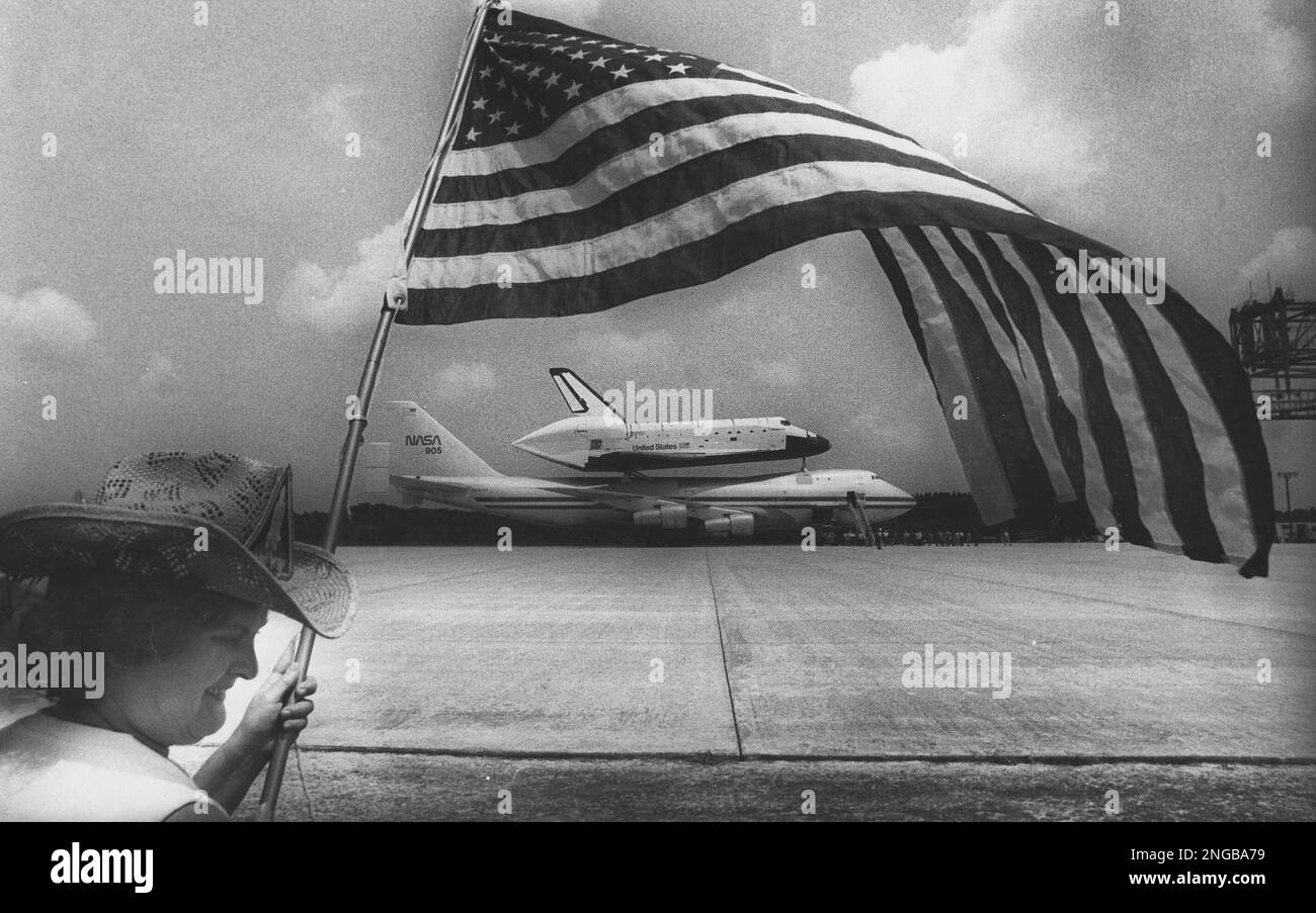 The space shuttle Challenger, aboard the back of the 747, is framed by ...