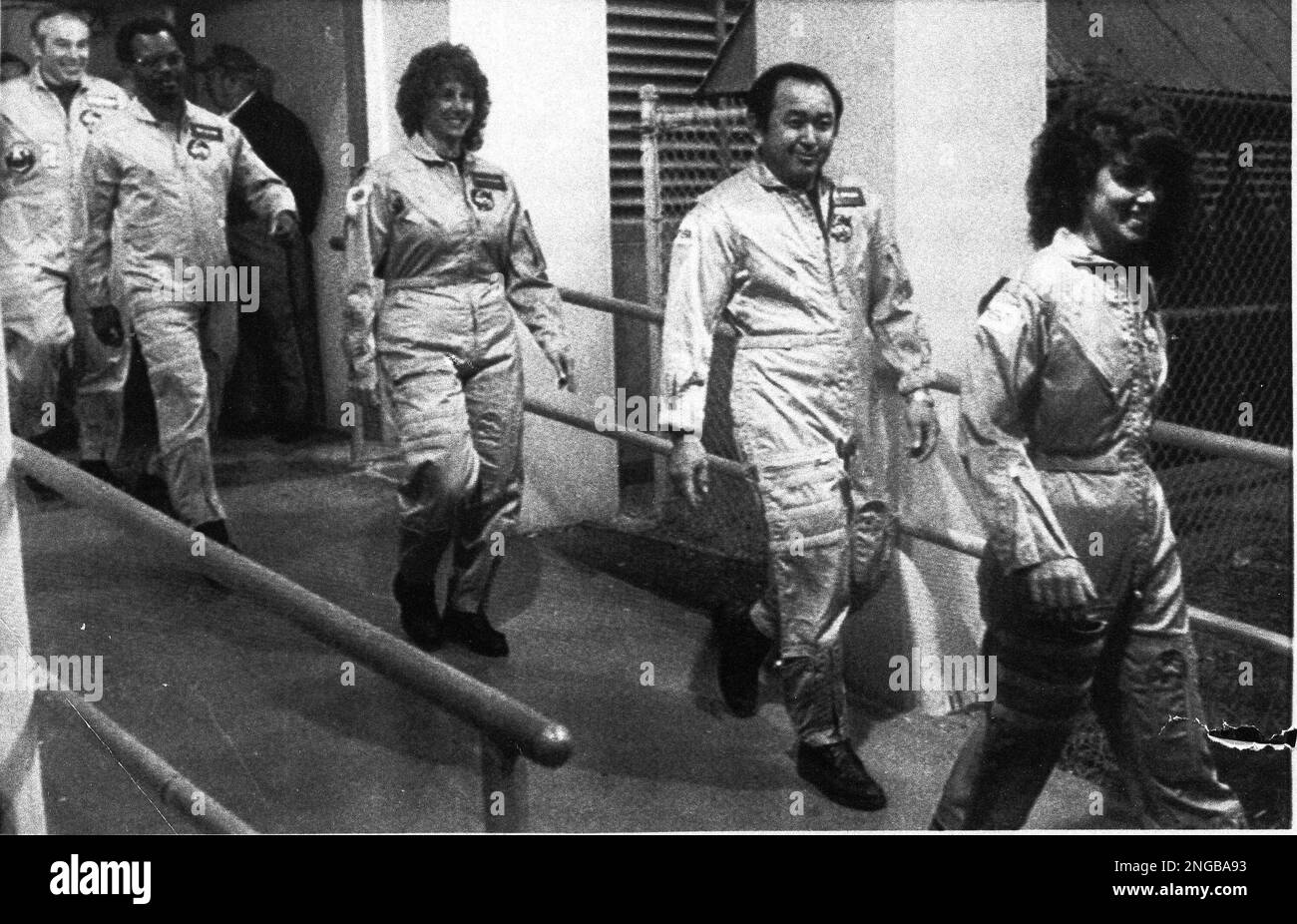 Space Shuttle Challenger crew members walk to the astronaut van for ...