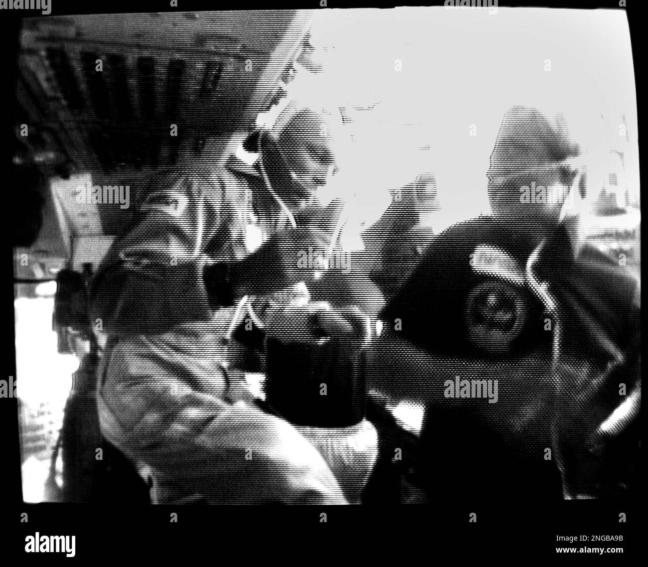 Space Shuttle Challenger mission specialist Story Musgrave, left, gets ...