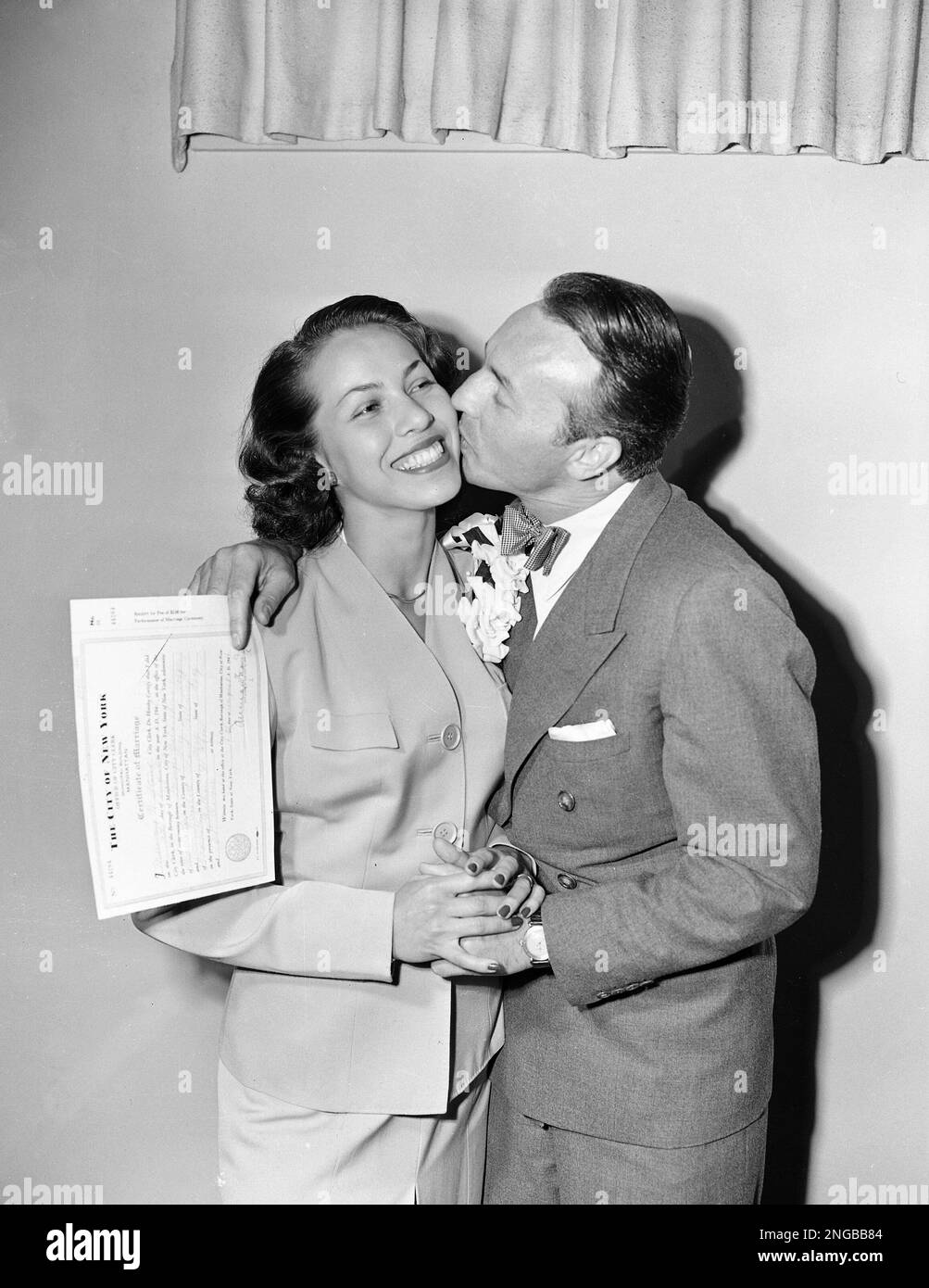 Artistic director and choreographer George Balanchine, right, kisses ...