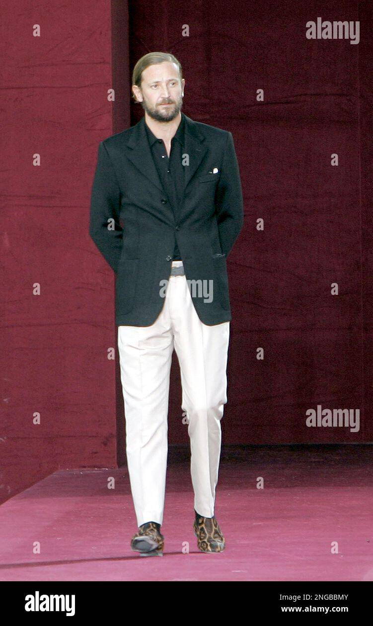 Italian fashion designer Stefano Pilati acknowledges applause from the ...