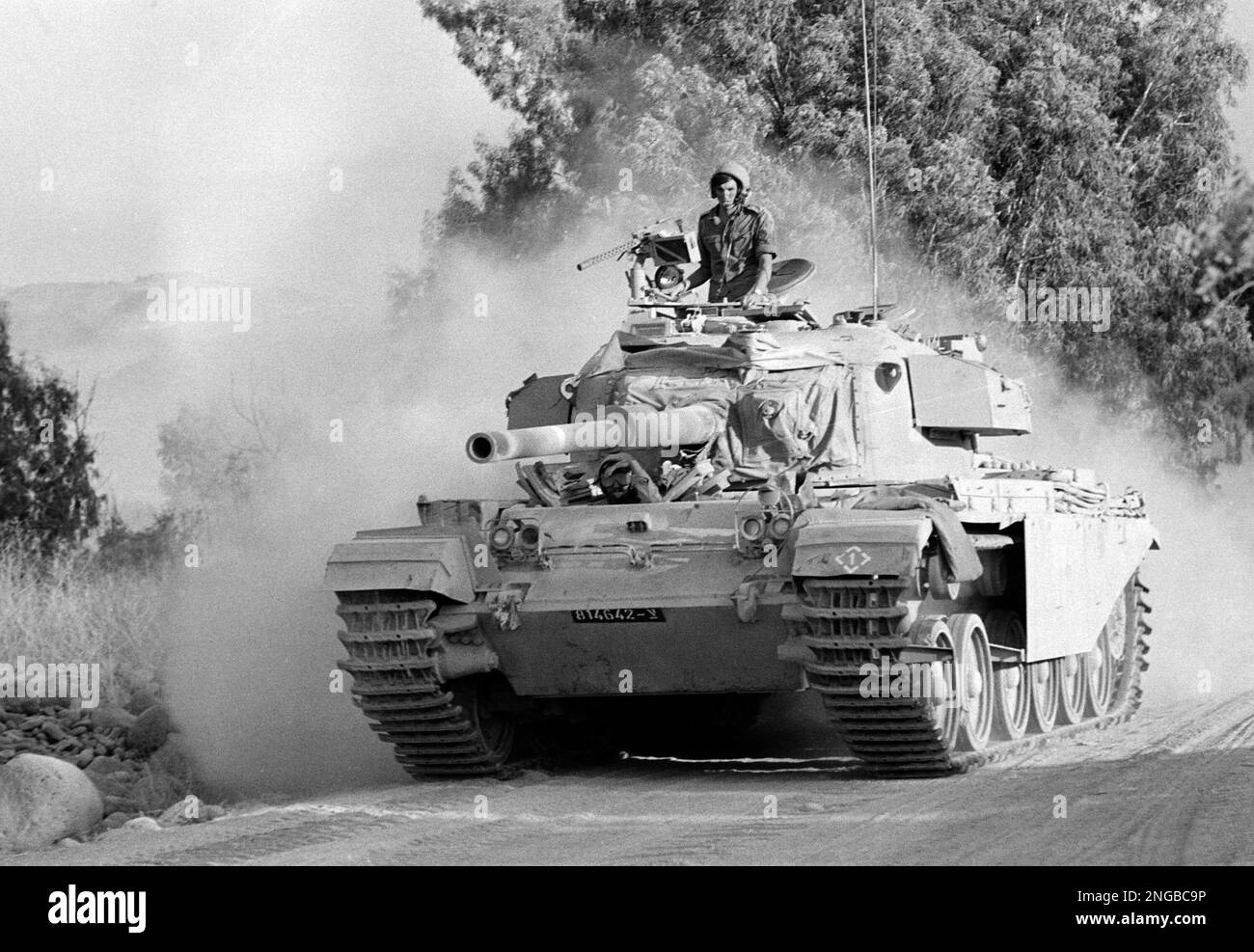 An Israeli tank grinds down a road in the occupied Golan Heights, Oct ...