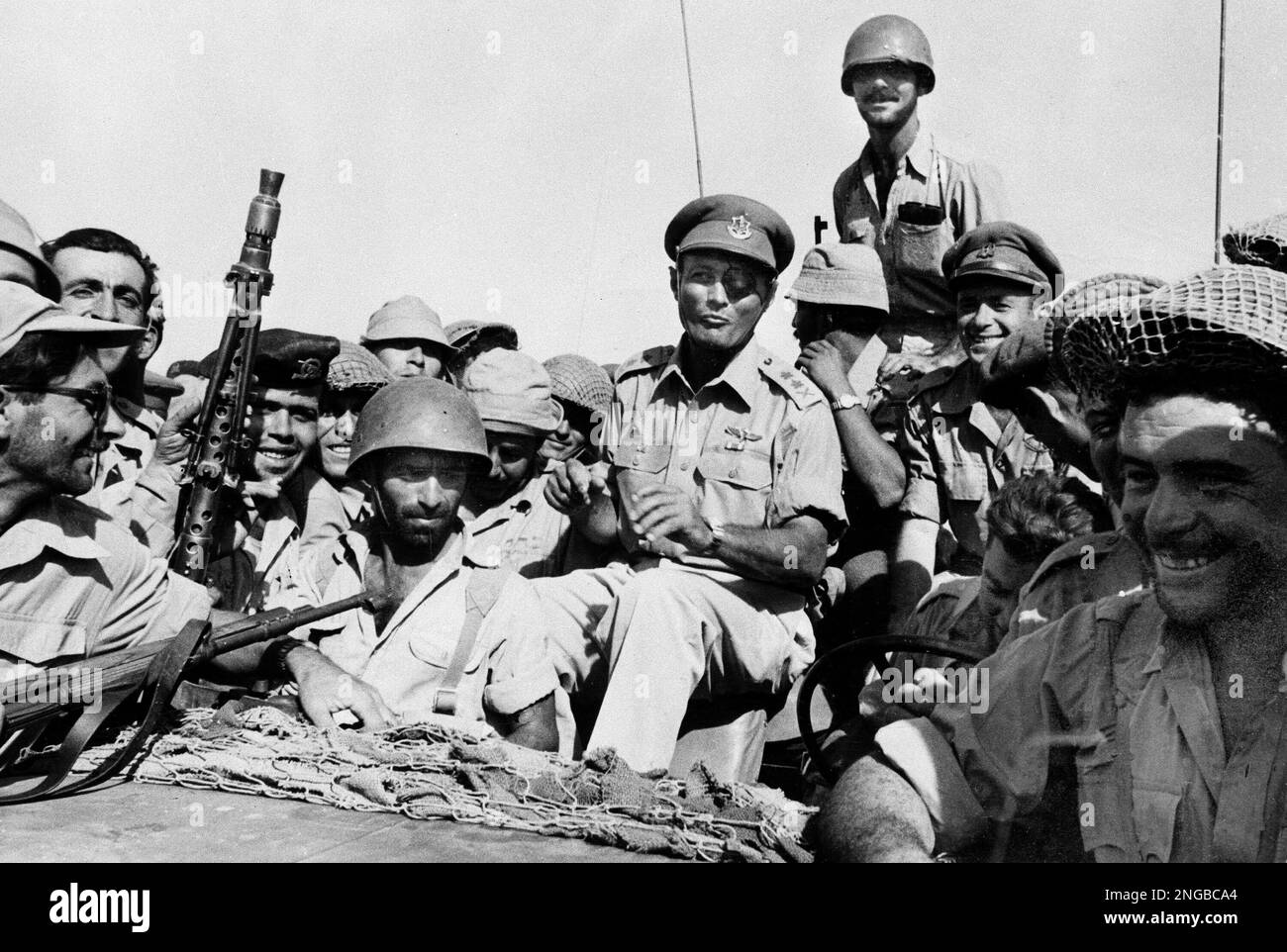Israeli soldiers crowd around their commander in chief, Major General ...