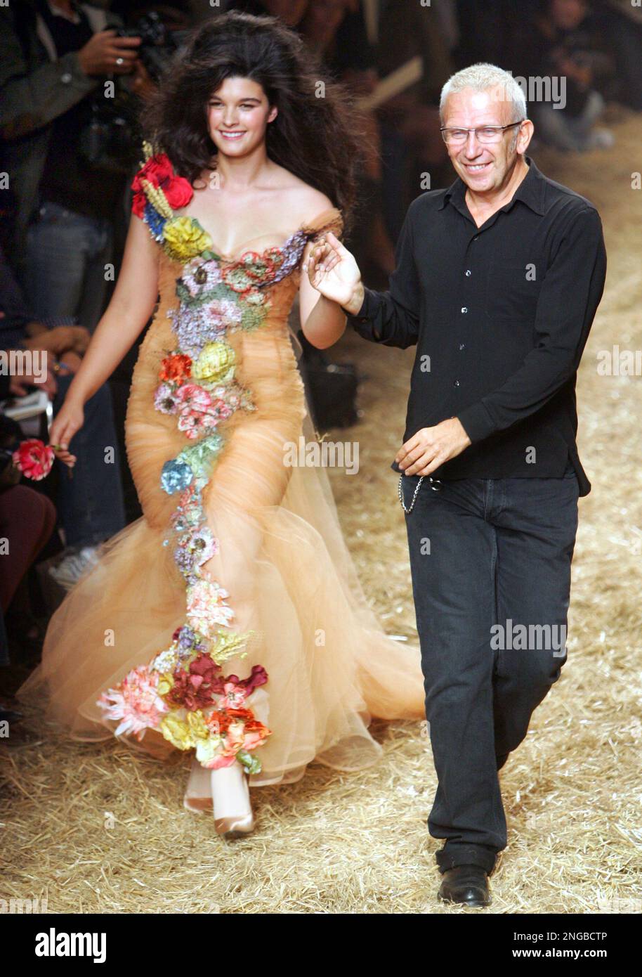 French fashion designer Jean-Paul Gaultier takes the catwalk with model ...