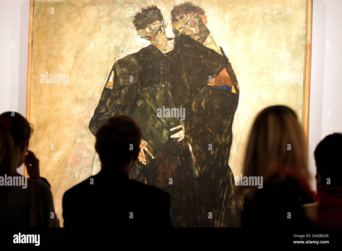 Visitors watch "The Loners", a 1912 oil on canvas by Austrian painter ...