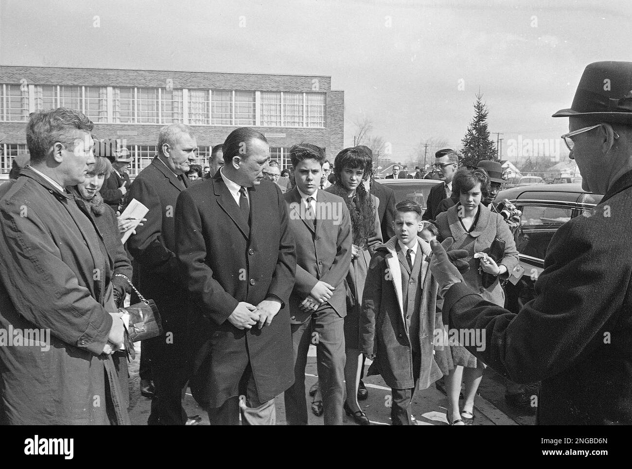 Anthony Liuzzo, left, arrives with his family at Immaculate Heart of St ...