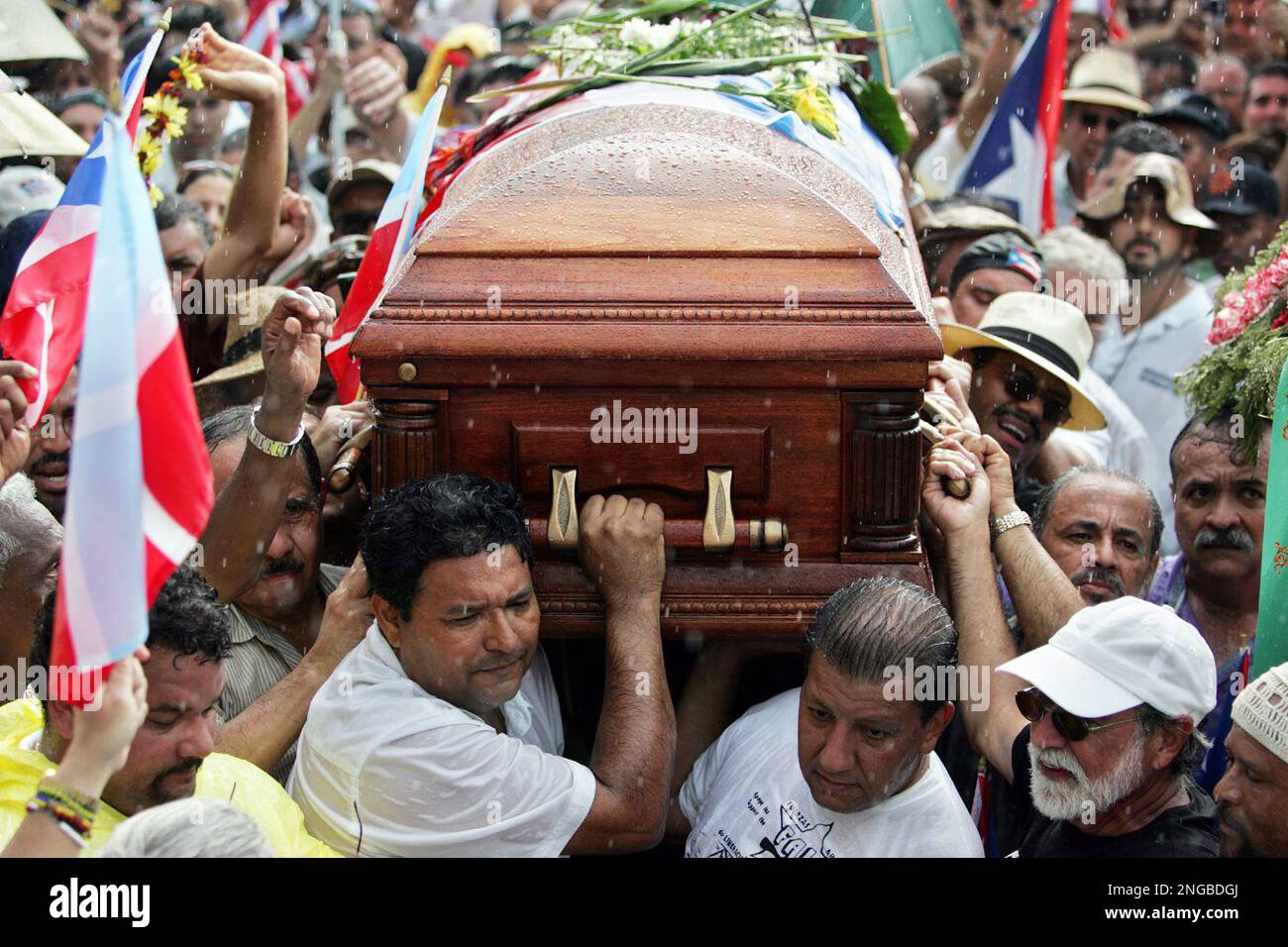 In this Sept. 27, 2005 photo, men carry the casket of Puerto Rican ...