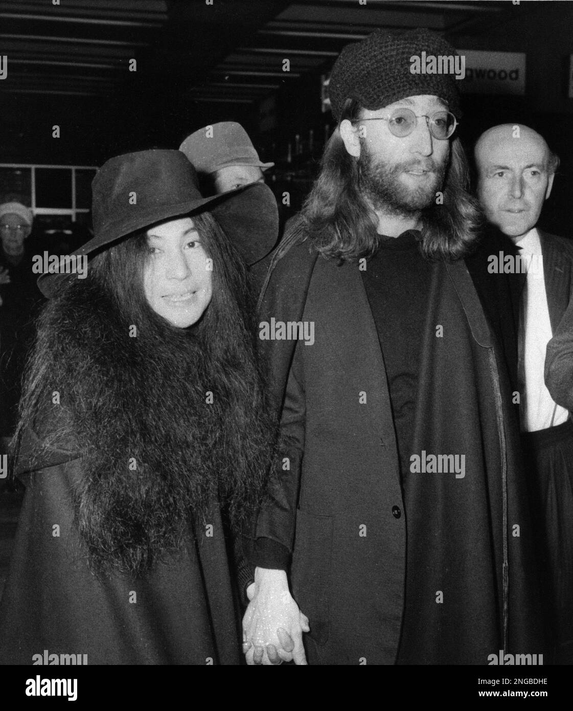 John Lennon and his wife Yoko Ono are seen at Heathrow Airport, London, Dec. 16, 1969, en route ...