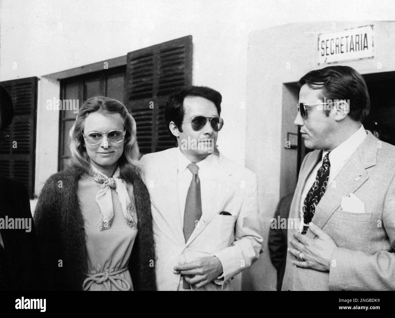 Anthony and Melinda Cox leave court with an unidentified U.S. consular ...
