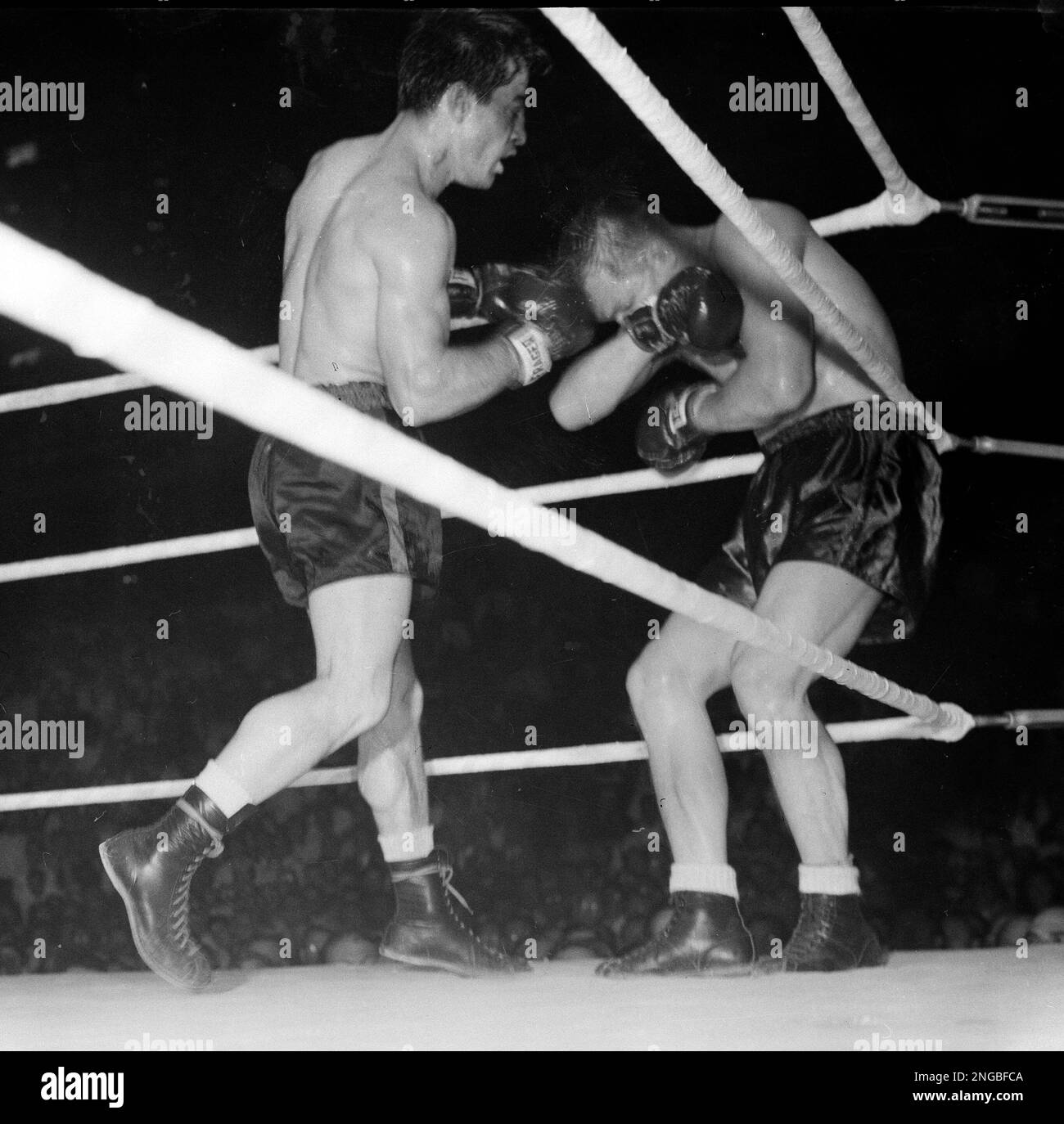 Caught in the corner, Tony Zale, right, tries to cover up as Rocky ...